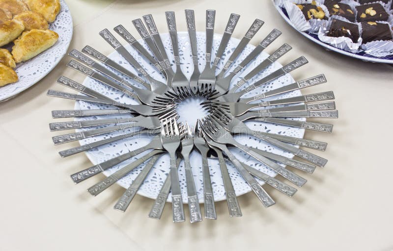 Silver forks on dish stock image. Image of cooking, closeup - 34381949