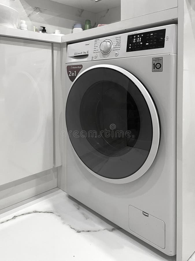 Silver Front-loading Washing Machine with a Digital Display and Control ...