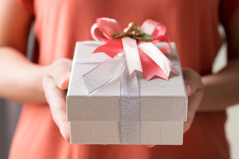 Silver Gift Box with Ribbon in Hand, Present for Giving Stock Photo ...