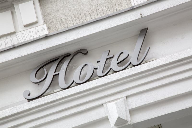 Silver Hotel Sign on Building Stock Image - Image of silver, entrance ...