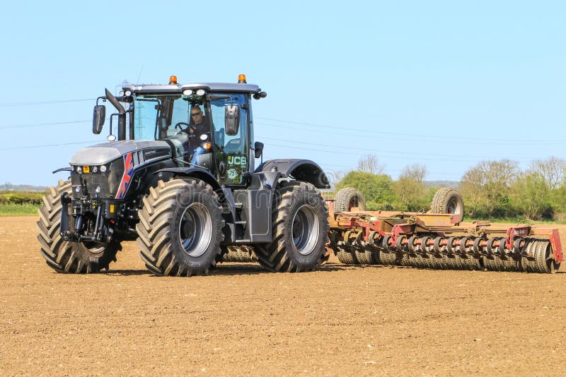 Silver Jcb Fastrac Working in Field with Roller Editorial Photo - Image ...