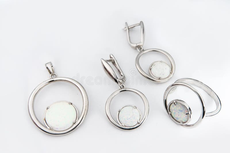 Silver Jewelry Set of Ring and Silver Earrings with Stones on White ...