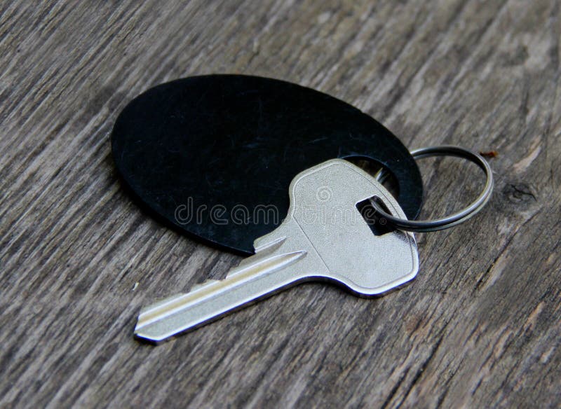 A Silver Key with Black Plastic Tag Stock Photo - Image of security ...