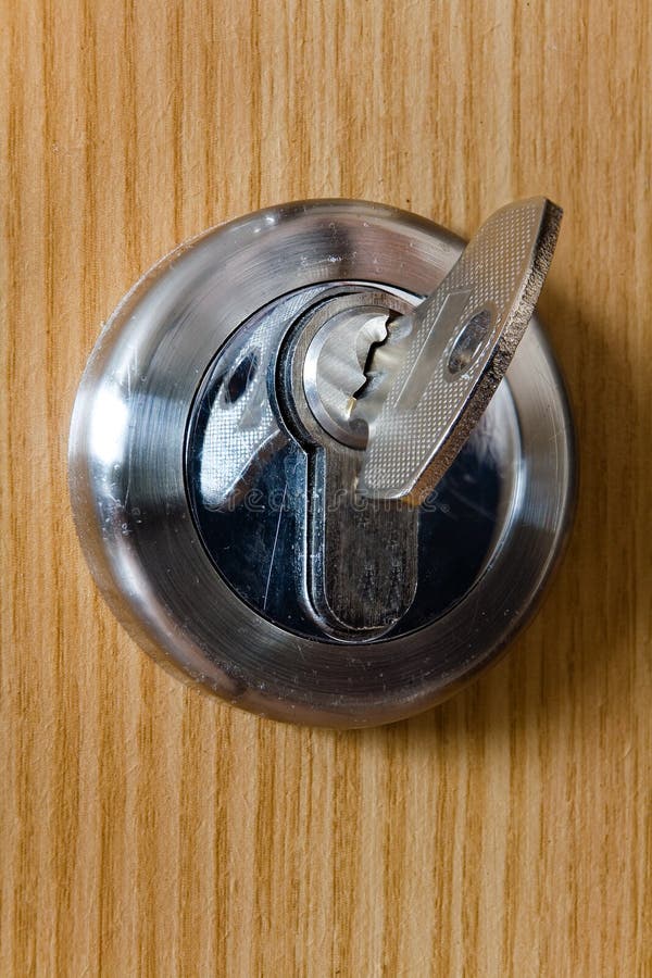 The Silver Key is Inserted into the Keyhole. Stock Image - Image of ...