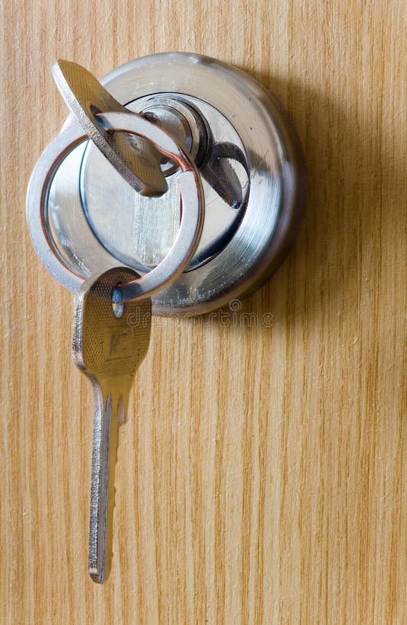 The Silver Key is Inserted into the Keyhole. Close-up. Stock Image ...