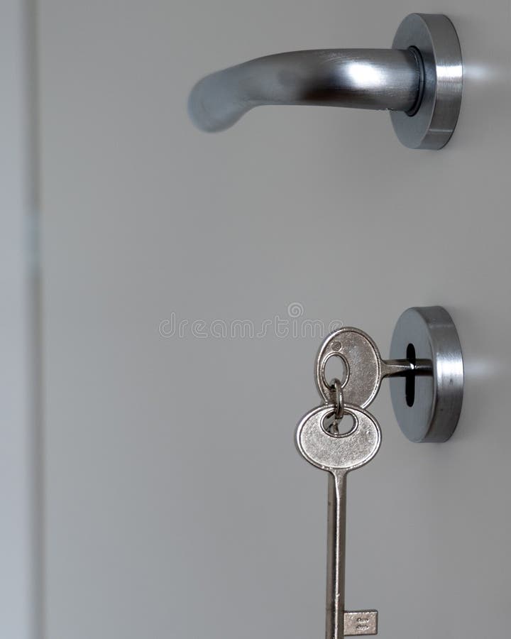 A Silver Key Inside the Door Lock. Stock Image - Image of business ...