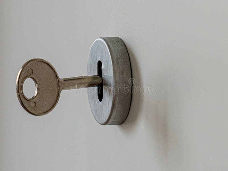 A Silver Key Inside the Door Lock. Stock Image - Image of silver, keys ...