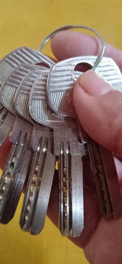 The silver keys on hand stock photo. Image of security - 182932560