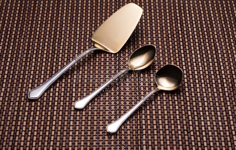 Silver Kitchen Utensils with Golden Spraying at the End. Stock Photo ...