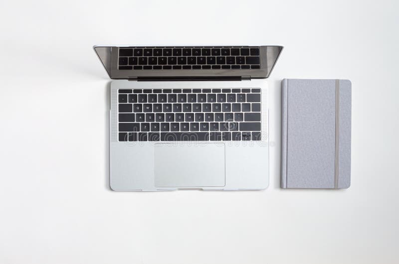 Silver Modern Laptop Computer with a Notebook Stock Photo - Image of ...