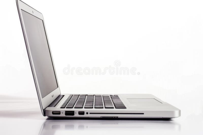 A Silver Laptop Computer is Shown from a Side View with the Screen ...