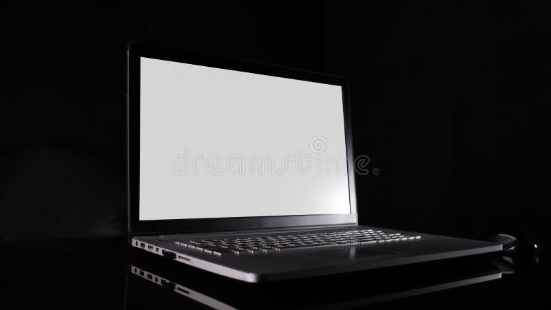 Silver Laptop in the Dark stock photo. Image of desk - 152624628