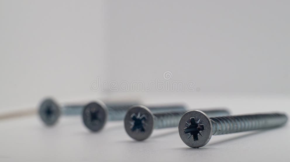Silver Large Metal Screws with a Phillips on a Macro Scale Stock Photo ...