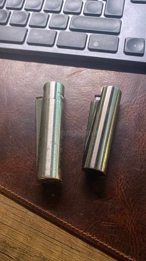 Silver Lighters on the Table Stock Image - Image of leather, table ...