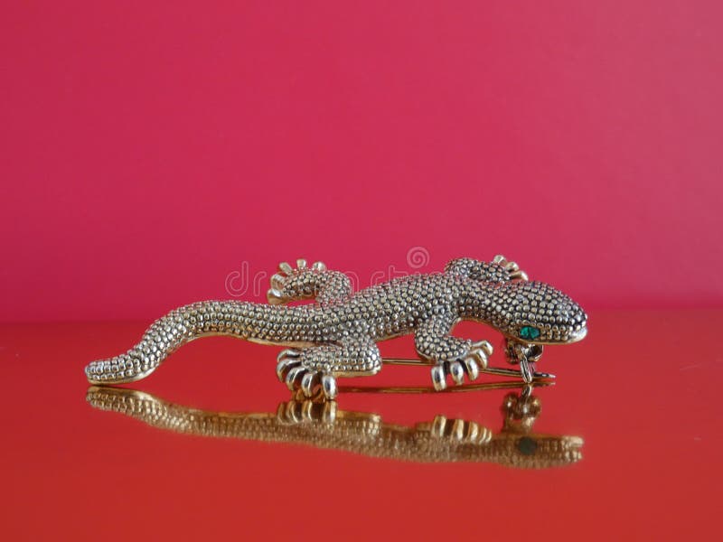 Silver Lizard Decoration on a Pink Background Stock Photo - Image of ...