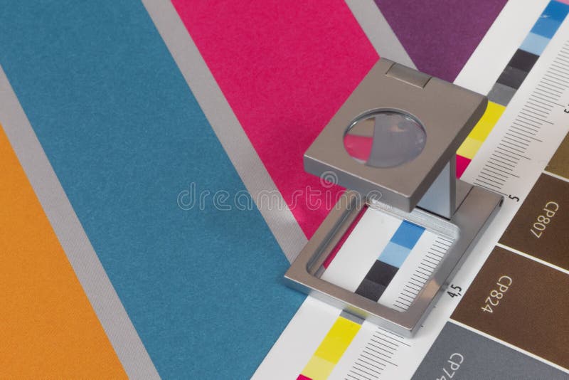 Silver Magnifying Glass Standing on the Test Print, Colored Background ...