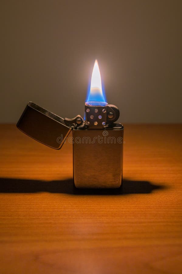 Silver Metal Lighter with Fire. Stock Image - Image of dark, macro ...