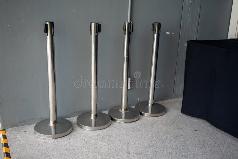 Silver Metal Pole Barriers Standing Against Grey Background Stock Image ...