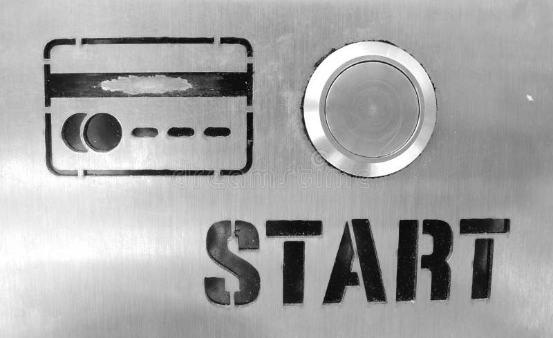 Silver-colored, Metal Surface with a Start Button and a Drawing of a ...