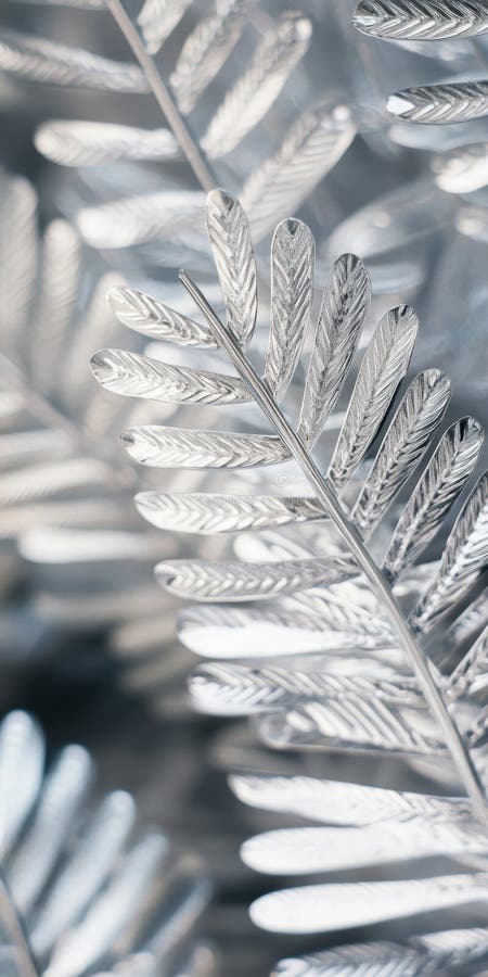 Silver Metallic Leaves with Intricate Patterns in Abstract Arrangement ...