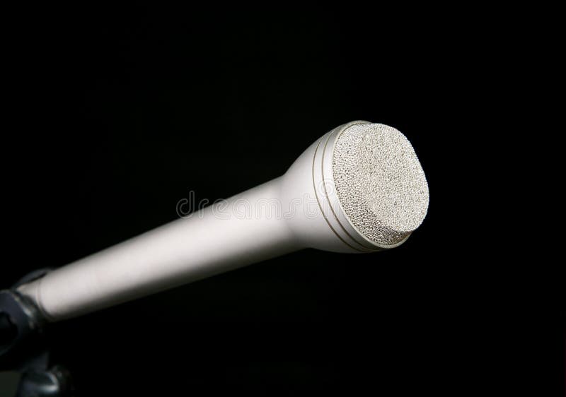 Silver microphone on black stock photo. Image of communication - 1449872