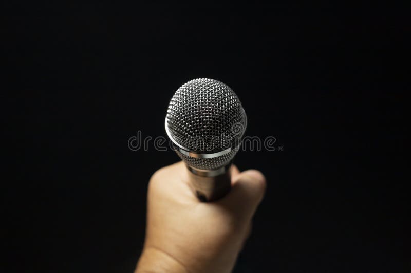 Black Microphone Male Singer S Hand Holding Microphone on Modern ...