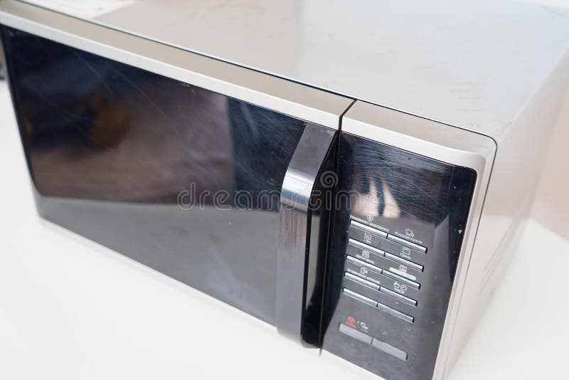 Silver Microwave Oven with Stains on the Case. Stock Photo - Image of ...