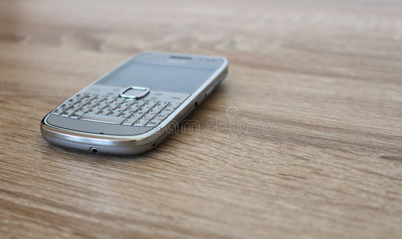 Silver Mobile Phone on the Wooden Table Stock Photo - Image of modern ...