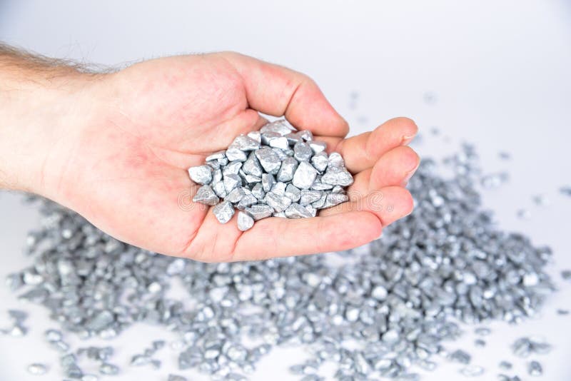 Silver nuggets in hand stock photo. Image of world, speculation - 207018386