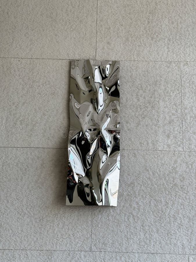 A Silver Object with a Curved Shape is on a White Background Stock ...