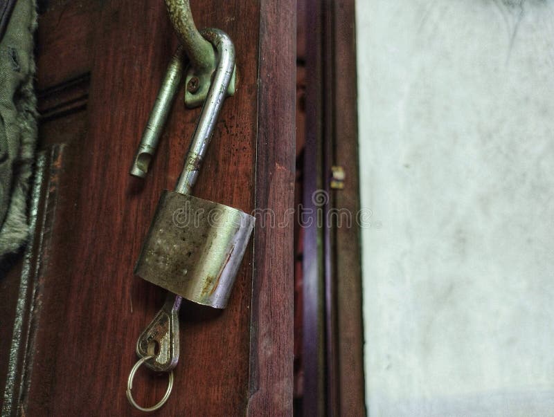 Silver Padlock Key Hanging from Doorknob Stock Photo - Image of detail ...
