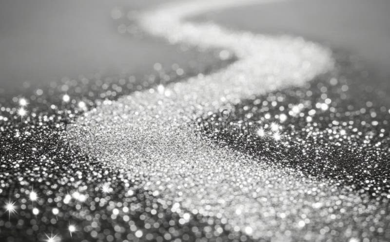 Silver Particles Scattered Across a Smooth Surface in a Well-lit Indoor ...
