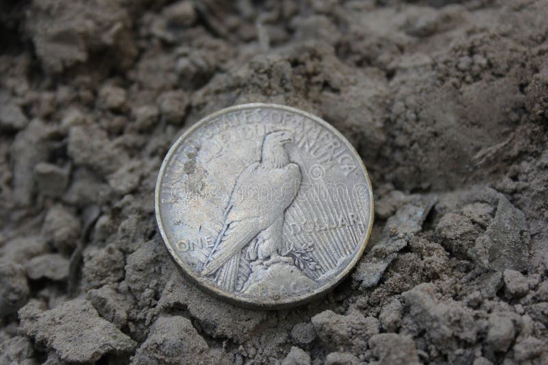1922 Silver Peace Dollar on Ground in Dirt. Back View Stock Photo ...