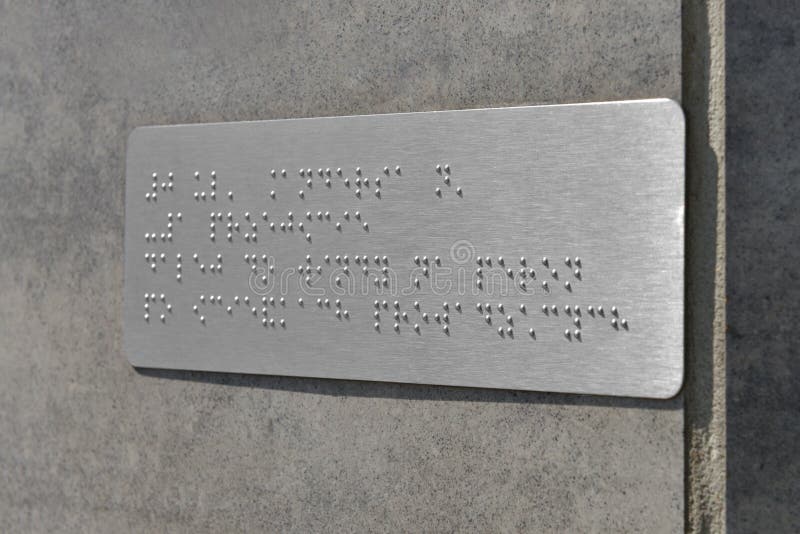 Silver Plate with Braille Text on Grey Wall, Closeup Stock Image ...