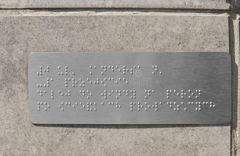 Silver Plate with Braille Text on Grey Wall, Closeup Stock Photo ...