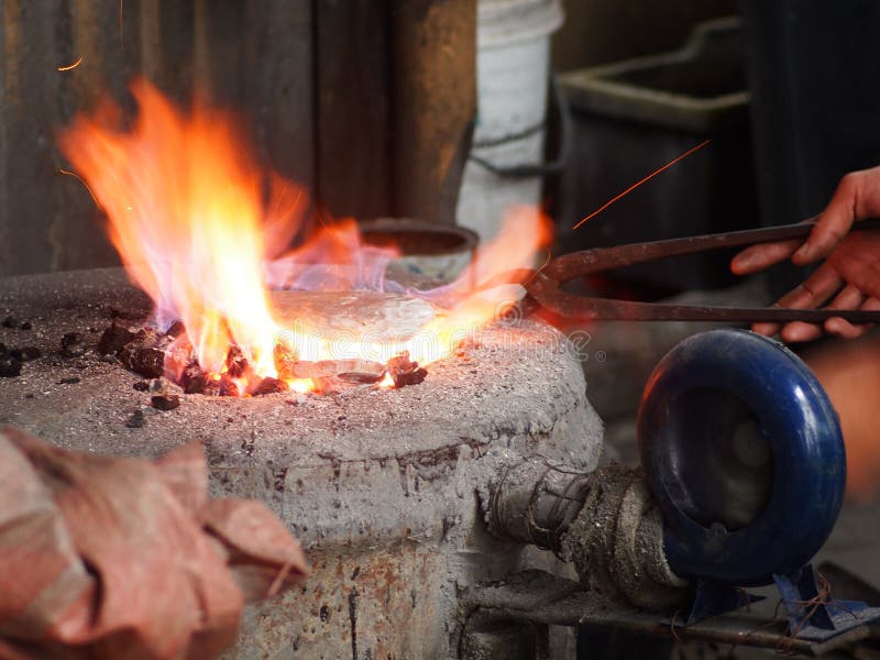 Silver Plate Heating by Craftsman Using Old Fashioned Appropriate ...