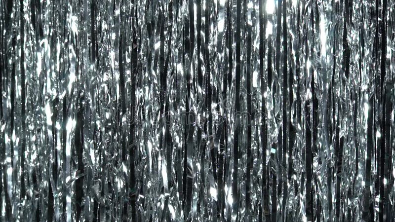 Silver Rain from Tinsel. Dynamic Background in Shining Lights and ...