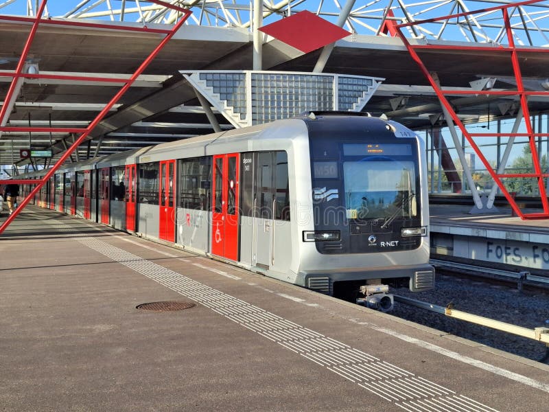 Silver and Red Metro Vehicles of the GVB in Amsterdam Along Platform ...