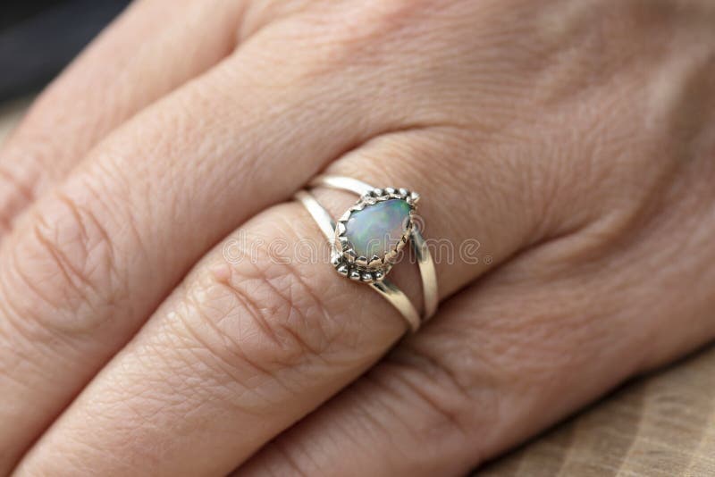 Silver Ring with Sapphire Gemstone on Female Hand Stock Image - Image ...