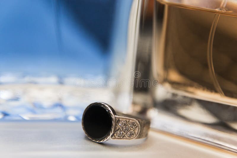 Silver Ring, Perfume and Computer Stock Image - Image of bottle ...