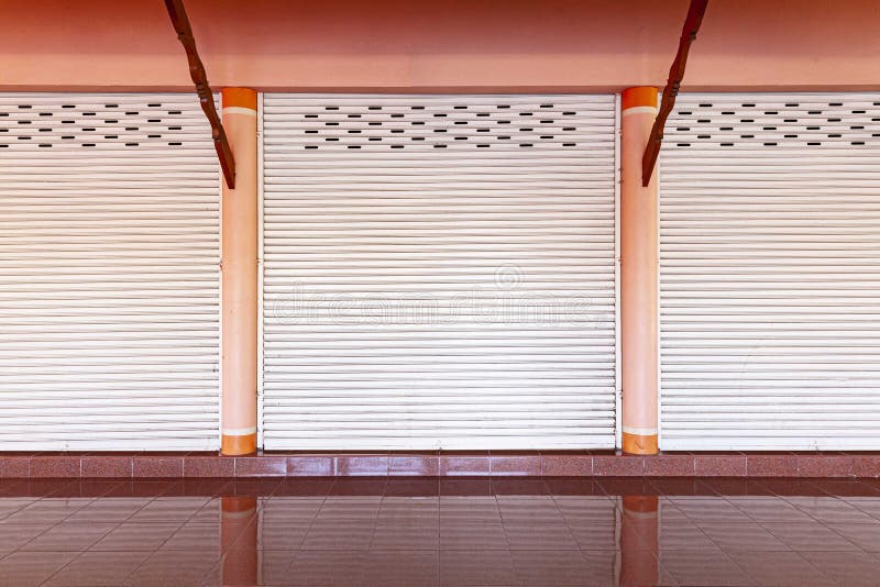 Silver Roller Shutter Door of the Store is Closed and Opened Stock ...