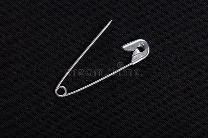Silver safety pin stock photo. Image of black, spike - 96540072