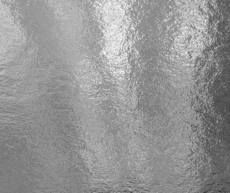 Silver Shiny Foil with Highlights and Uneven Texture Stock Image ...