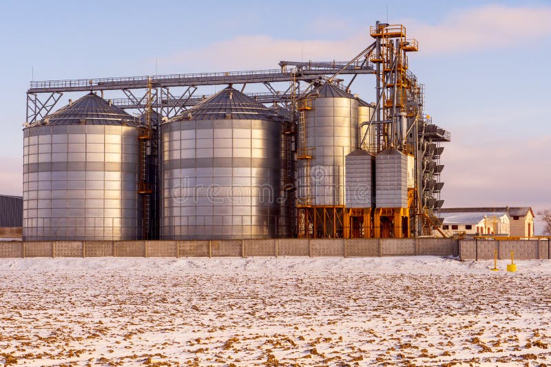 Silver Silos Against the Blue Sky in Winter. Grain Storage in Winter at ...