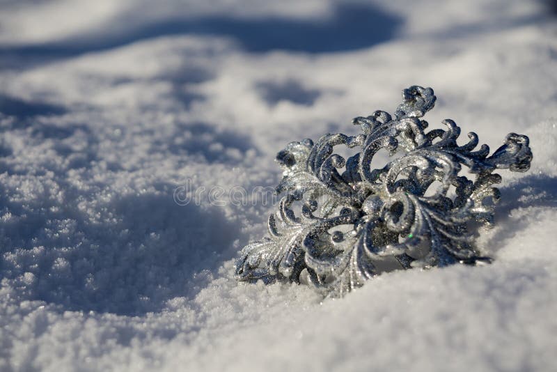 Silver Snowflake on Snow stock image. Image of glittering - 64211321
