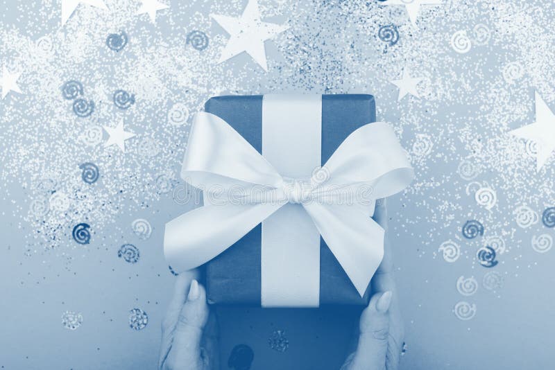 Silver Sparkles Glitter on Deep Blue Backdrop with Gift Box. Christmass ...