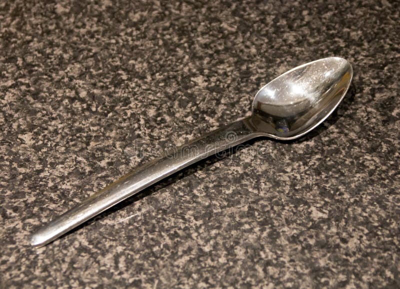 Spoon on a Dark Work Top Surface Stock Image - Image of homeware, food ...