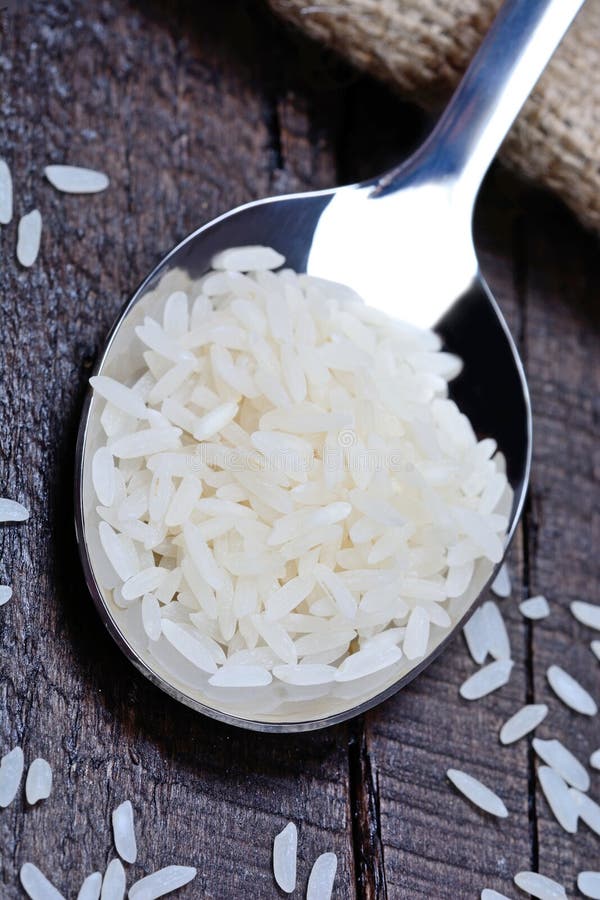 Red rice in a silver spoon stock image. Image of closeup - 89200535