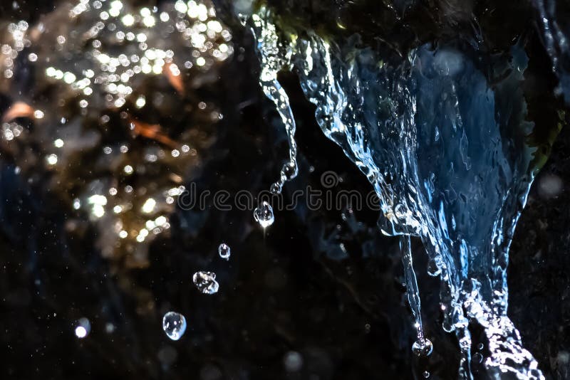 Silver Stream of Water Pouring from a Rock Stock Photo - Image of ...