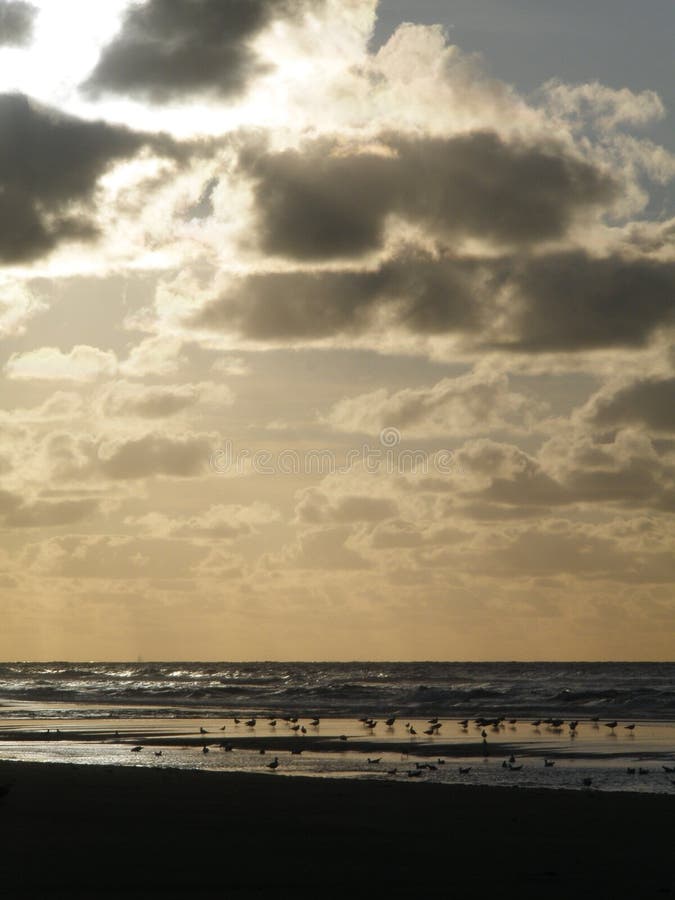 Silver Sunset Above the Sea, Sun Shining through the Clouds. Stock ...